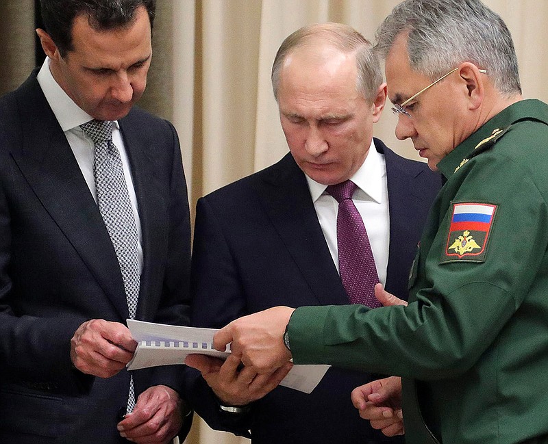 On surprise Russia trip, Assad and Putin talk post-war Syria ...