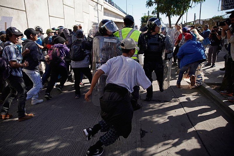 Migrants rush border, met with tear gas | Texarkana Gazette