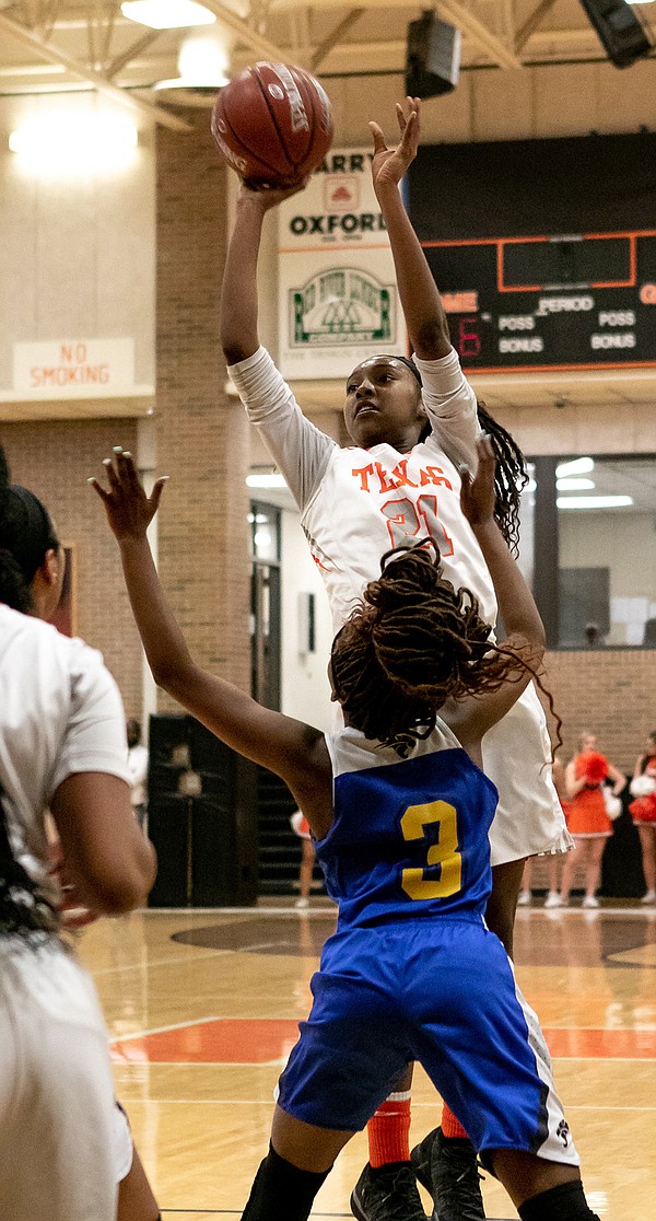 Lady Tigers tie for title