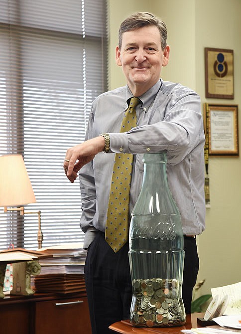 Attorney donates bottle of coins to Big Brothers Big Sisters ...