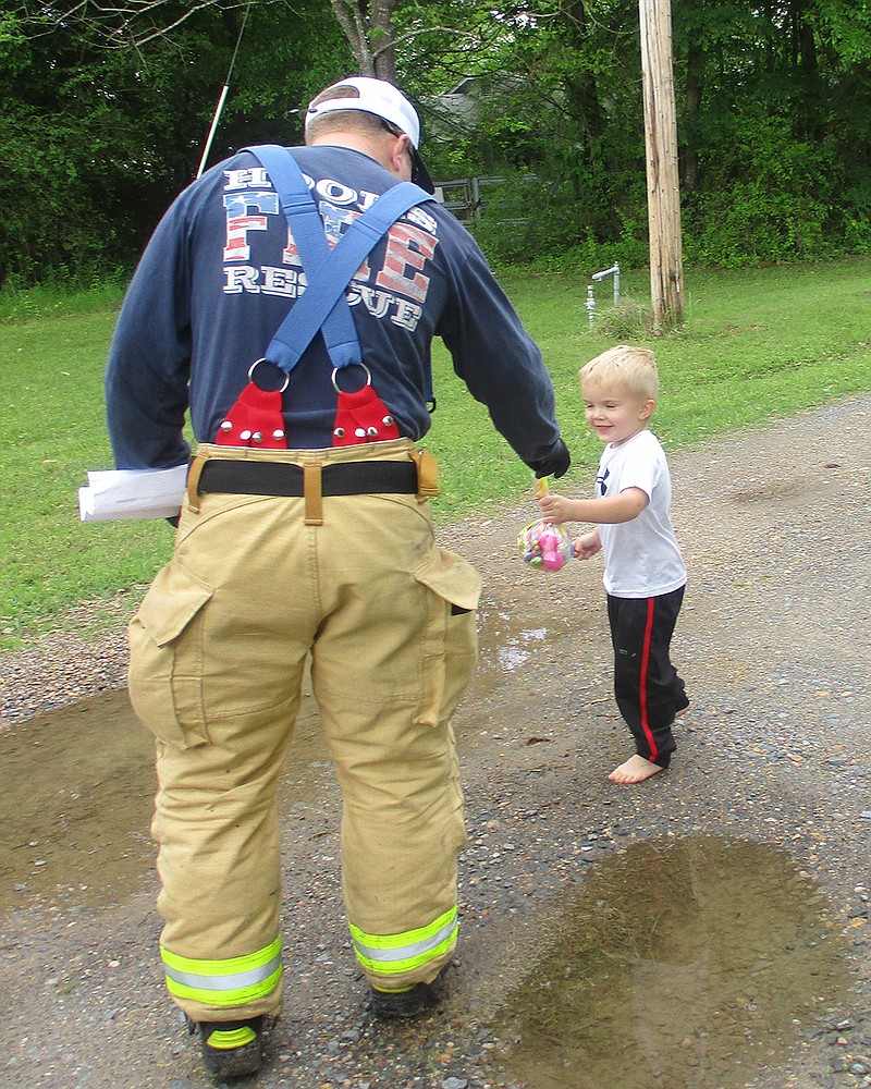 Fighting fear, lighting smiles: Hooks firefighters distribute Easter ...