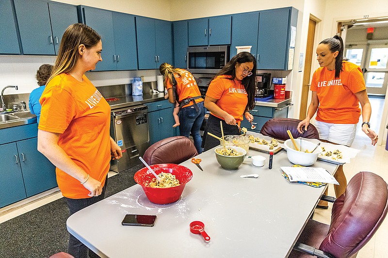 Volunteers pitch in for Days of Caring at United Way agencies ...
