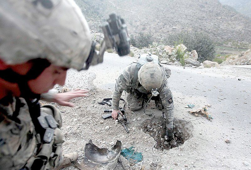 ’10 NATO troop deaths in Afghanistan hit 700 | The Arkansas Democrat ...