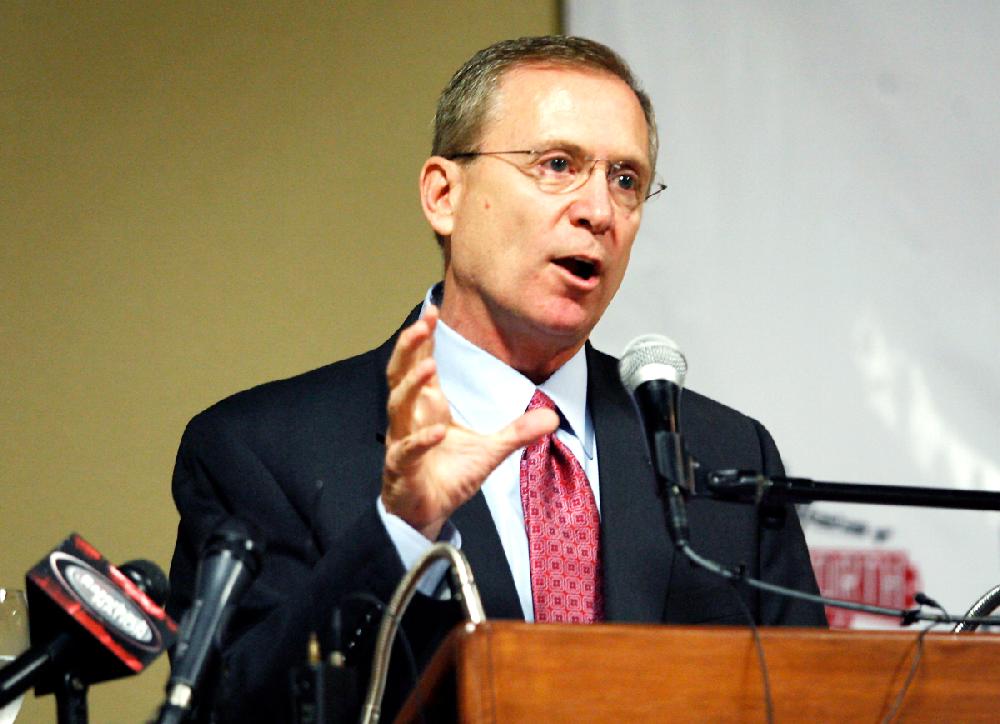 WholeHogSports - Long stands behind Smith