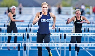Track And Field: Rogers' Workman Soars To Triple Jump Record ...