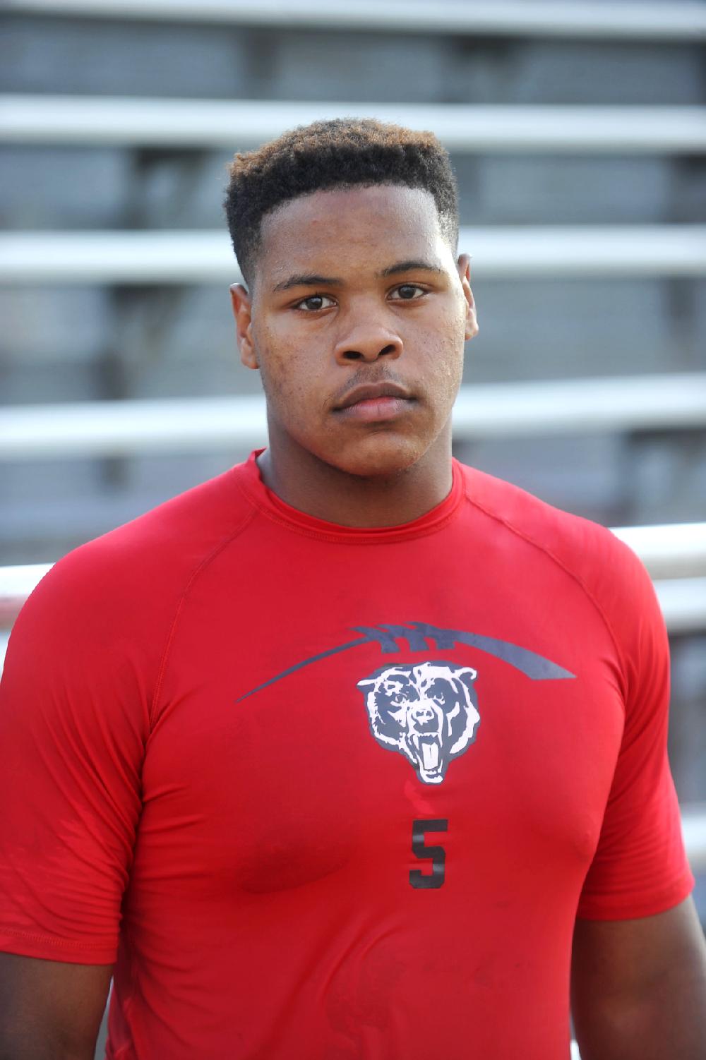 WholeHogSports - Dean thinking of future while inking with Hogs