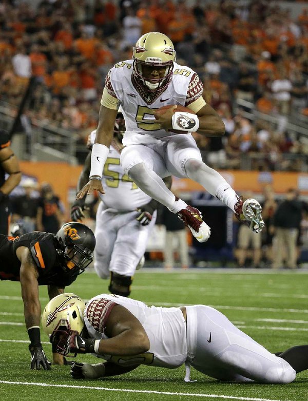 Winston holds off spirited Cowboys