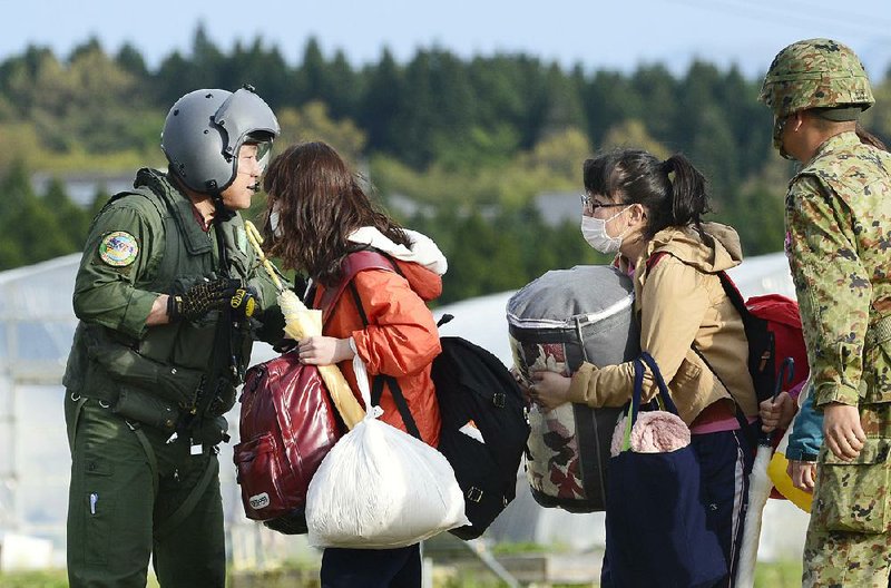 Rescuers in Japan search rubble