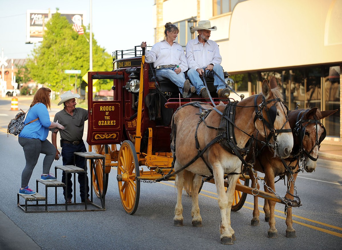 Wagon masters deliver guests on Springdale's rodeo's stagecoach ...