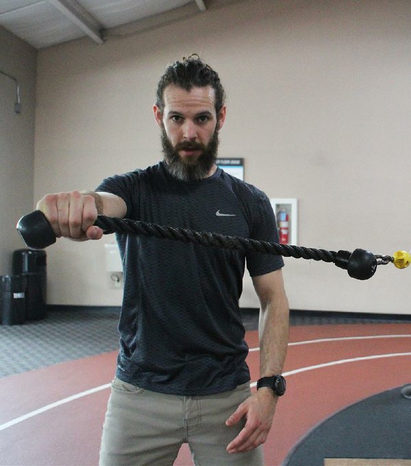 Lateral Rope Extension targets triceps muscles