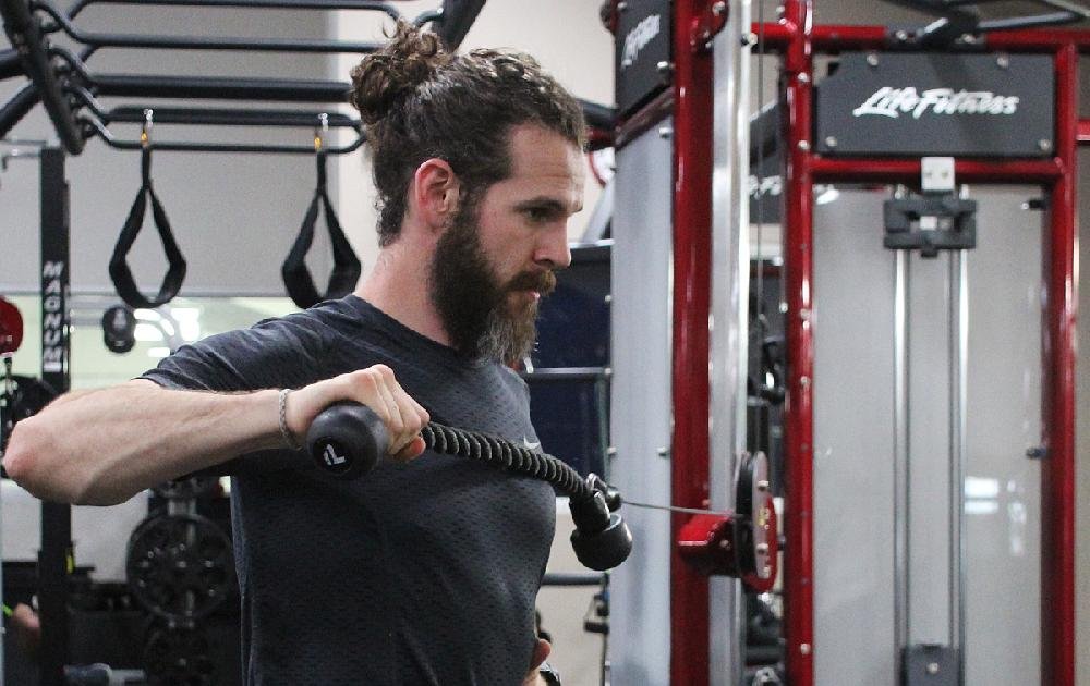 Lateral Rope Extension targets triceps muscles