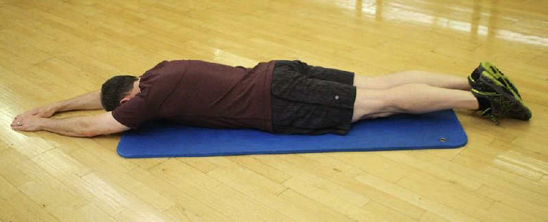 Floor Angel warms up lower back for core routine | The Arkansas ...