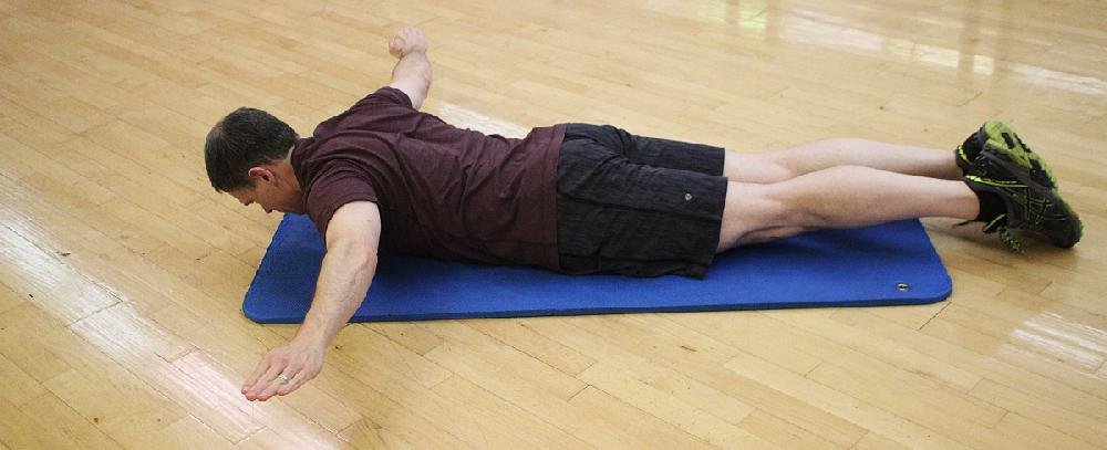 Floor Angel warms up lower back for core routine