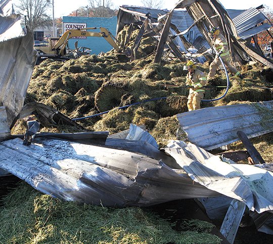 Two charged with arson in hay barn fire