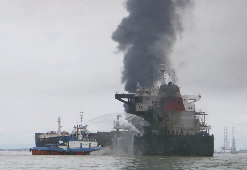 Oil spill fire chokes Indonesian port city; four dead | Northwest ...