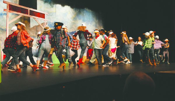 Honk Jr. dances on stage