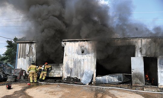 Auto shop fire began in vehicle, chief says