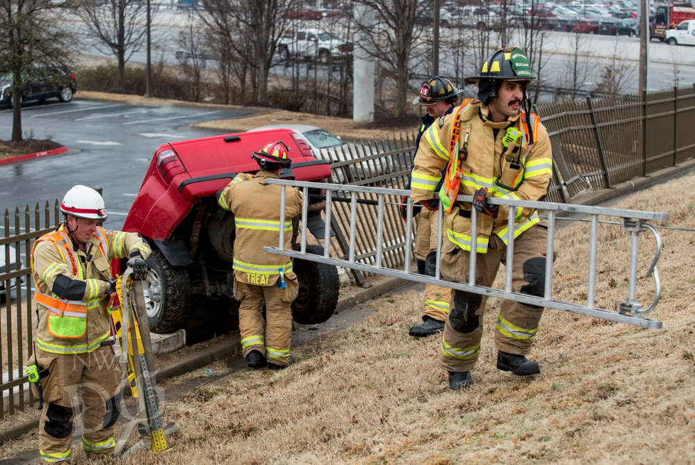 PHOTOS: Pickup skids off icy overpass in Northwest Arkansas, ends up ...