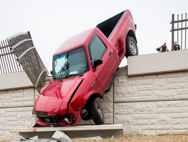 PHOTOS: Pickup skids off icy overpass in Northwest Arkansas, ends up ...