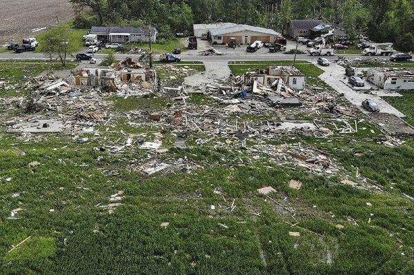 Crush of tornadoes spreads damage across 8 states