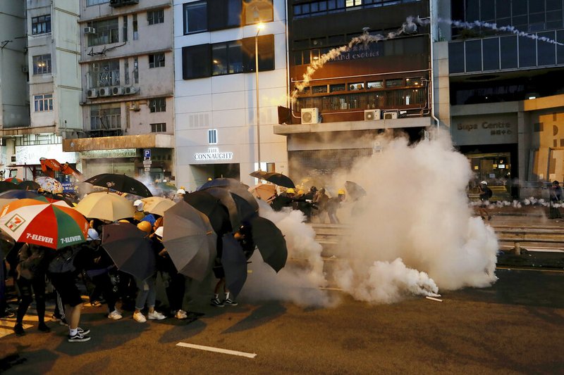 Police fire tear gas as Hong Kong protesters block roads | Northwest ...