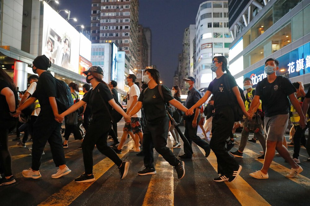 Hong Kong lawmakers seek to block mask ban; protests persist