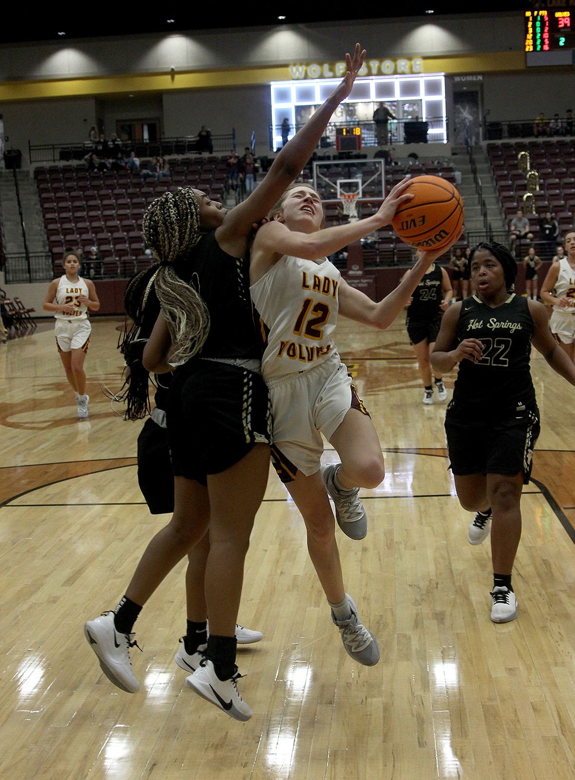 Lady Wolves roll from start to down cross-county rival Lady Trojans ...