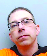 Sheriff coaxes man off roof of house | El Dorado News