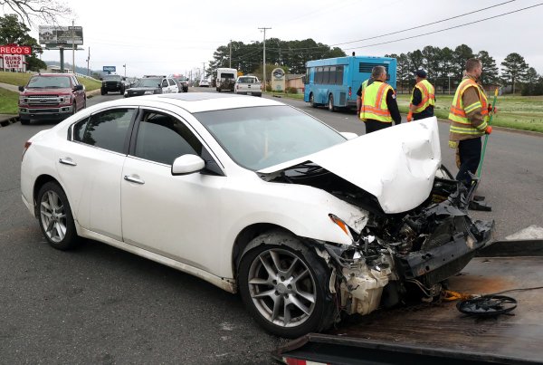 City bus hits car