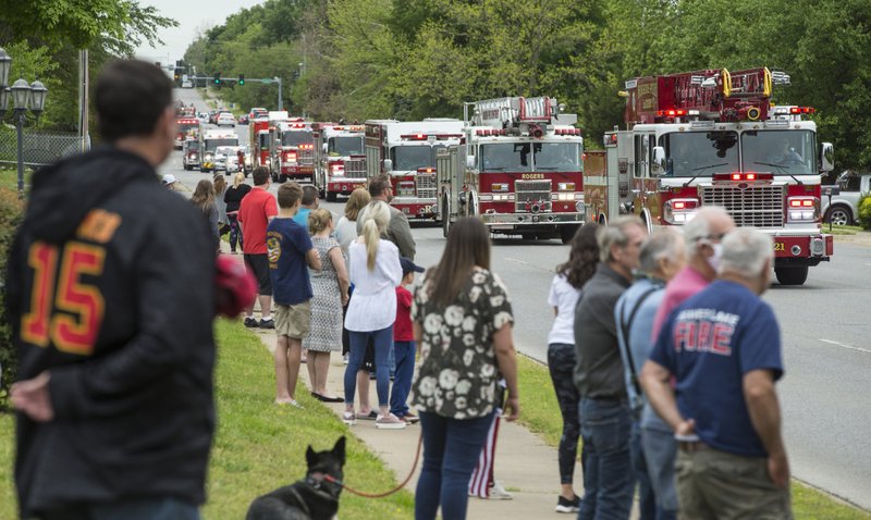 VIDEO, PHOTOS: Emergency vehicles form procession for Rogers fire ...