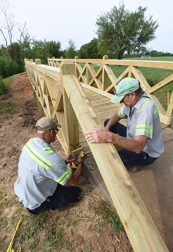 PHOTO GALLERY: Bridge construction in Rogers, new teachers and baton ...