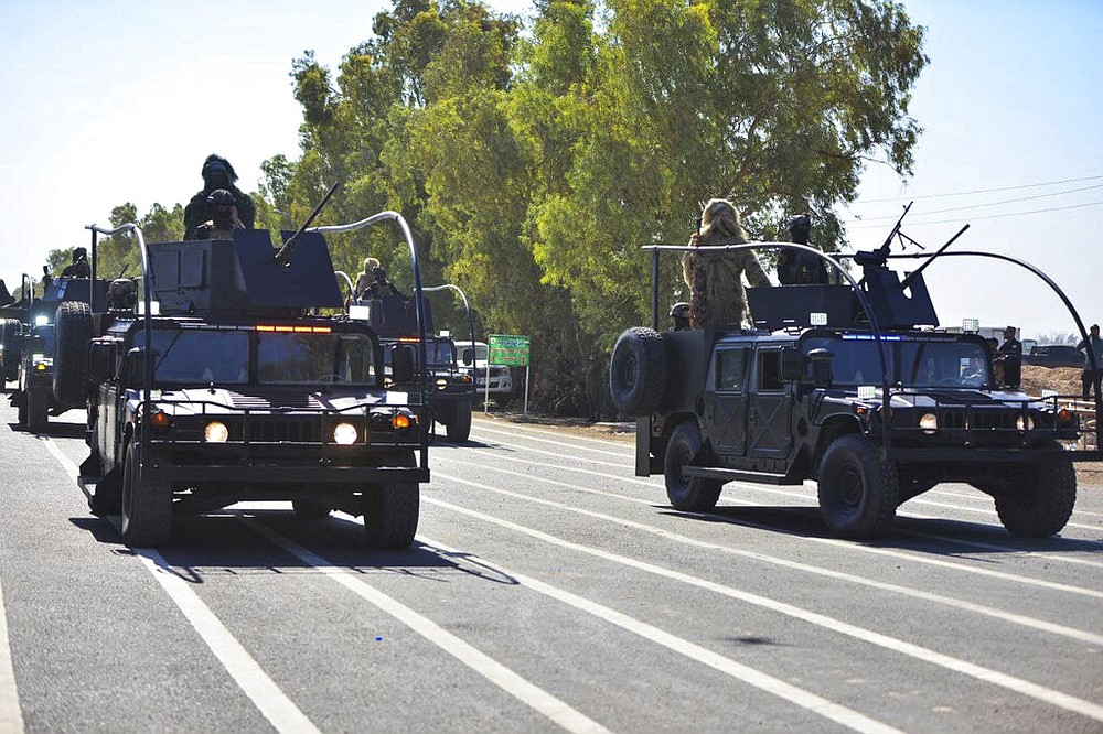 Popular Mobilization Forces parade in Iraq | The Arkansas Democrat ...