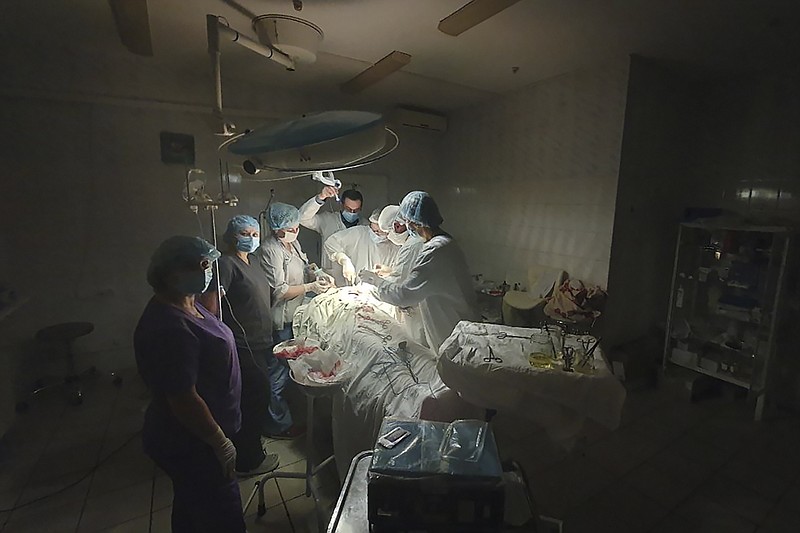 Surgeons work by flashlight as Ukraine power grid battered ...