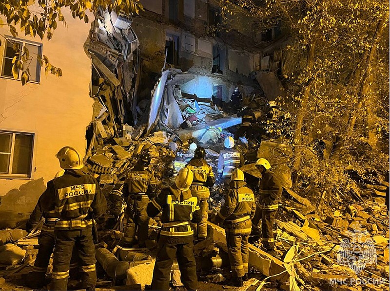 The world in brief: Rescuers search fallen Russian building | Northwest ...