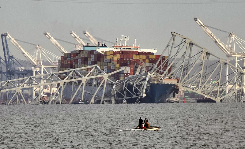 Baltimore bridge collapses after powerless cargo ship rams into support ...