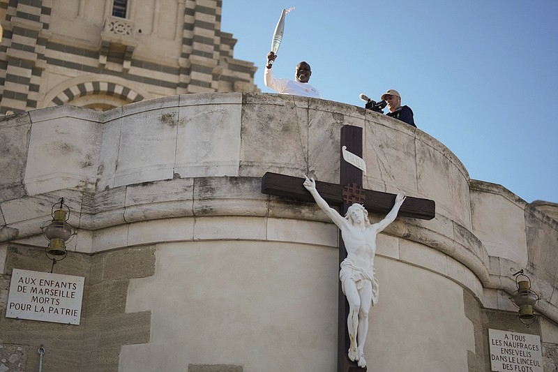 Torchbearers in Marseille kick off the Olympic flame's journey across ...