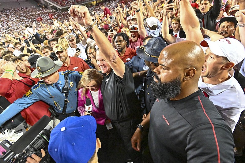 Party like it's 1999: Arkansas football fans storm the field following ...