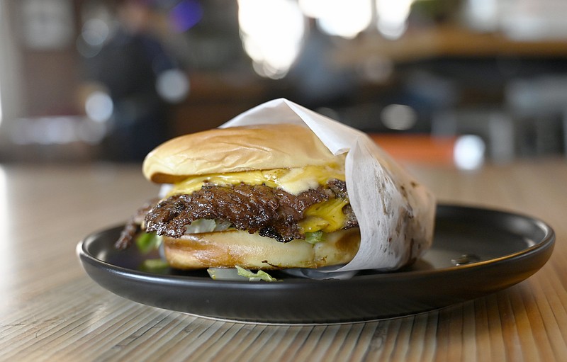 Staff photo by Abby White / The Murder Burger featured at Lo Main in ...