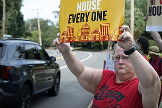 Protesters deliver letter to Hill’s door opposing cuts to federal ...