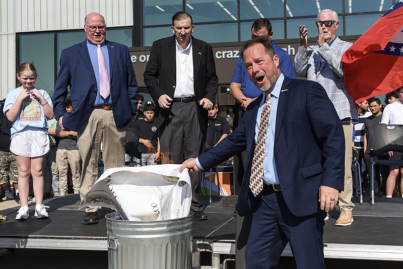 Saline County celebrates paid-off technical school by burning the bond ...