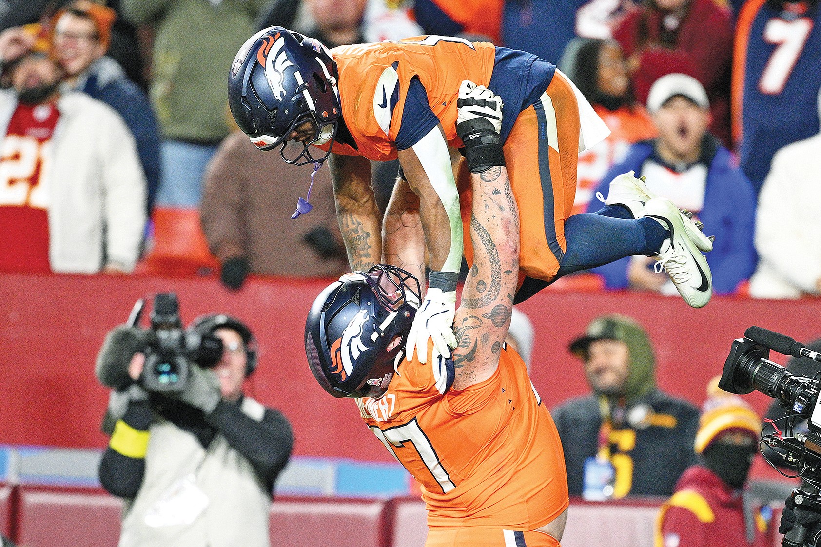 Broncos host first playoff game in decade, face banged-up Bills in ...