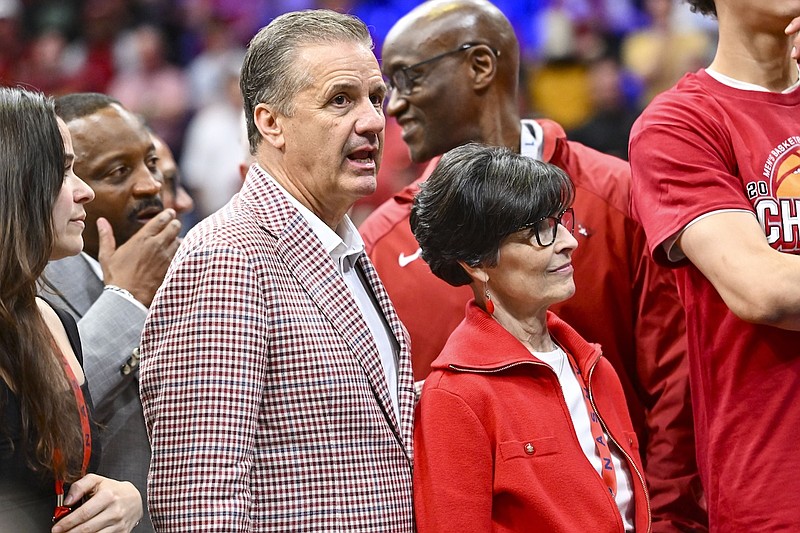 Arkansas basketball coach John Calipari, with family by his side, makes ...