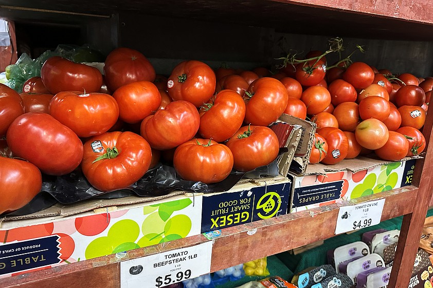 Tomatoes await customers on the shelves of a supermarket in New York on ...