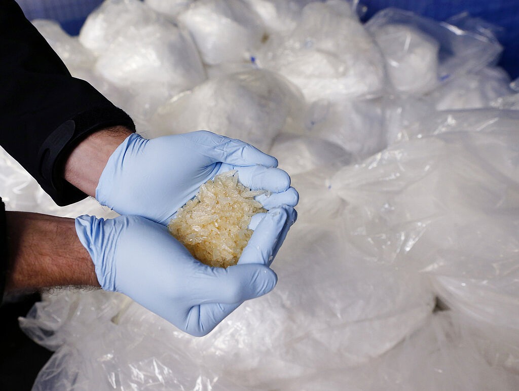 A criminal expert shows crystal methamphetamines in this Nov. 13, 2014 ...