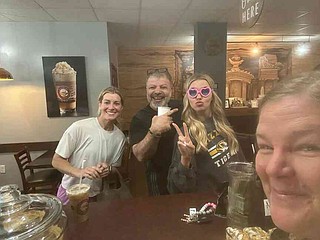 High school seniors chase each other with water guns in game sweeping ...