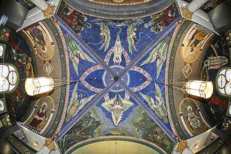 Inside a historic church painted with murals that reflect searing ...