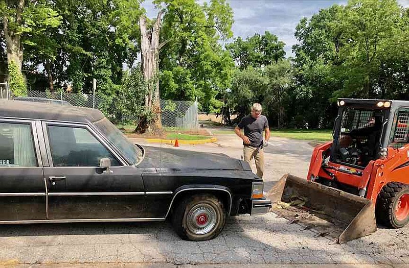 New owners clear hearses, garbage from Buescher Funeral Home ...