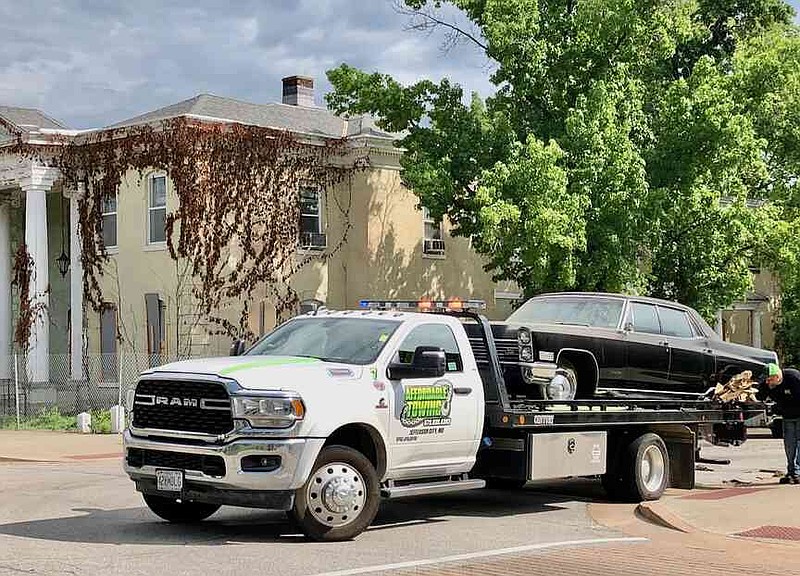 New owners clear hearses, garbage from Buescher Funeral Home ...