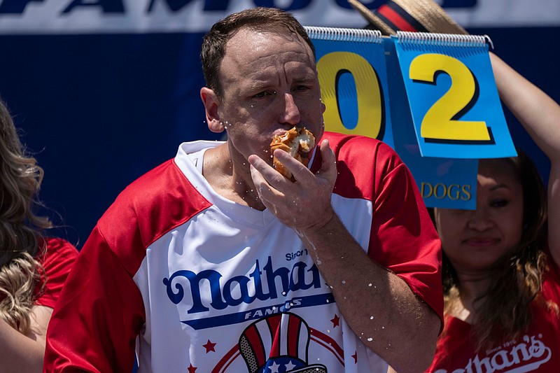 Joey Chestnut reclaims title in Nathan's Famous hot dog eating contest ...