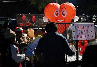 Legacy Heart Walk volunteers prepare their float for the 41st Christmas ...